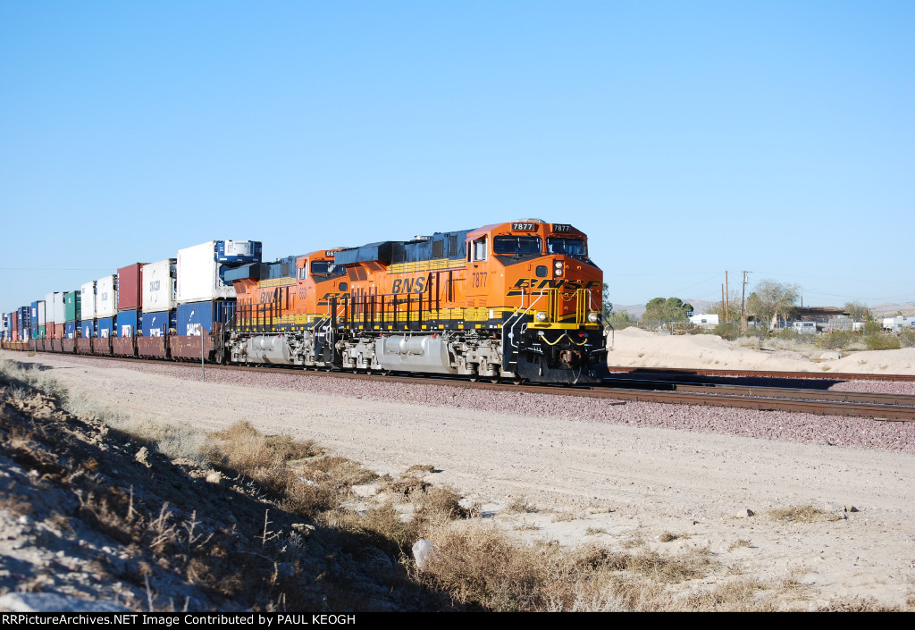 BNSF 7877 with BNSF 6631 behind her slow down for a crew swap at the BNSF Barstow yard.